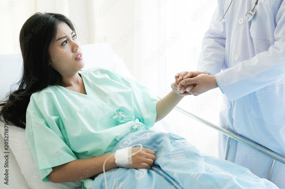 Doctor with patient. Routine health check and holding hands. Male ...