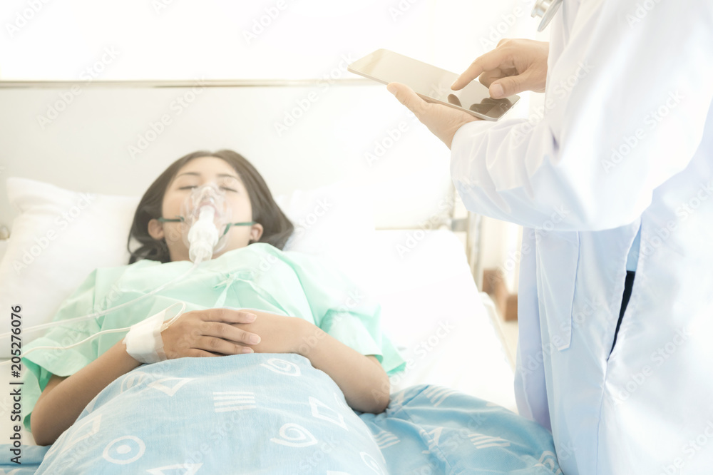 Doctor with patient. Routine health check and taking notes. Male ...