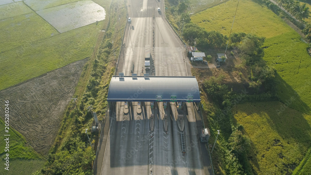 Highway with a toll payment point. Aerial view: Cars passing through ...