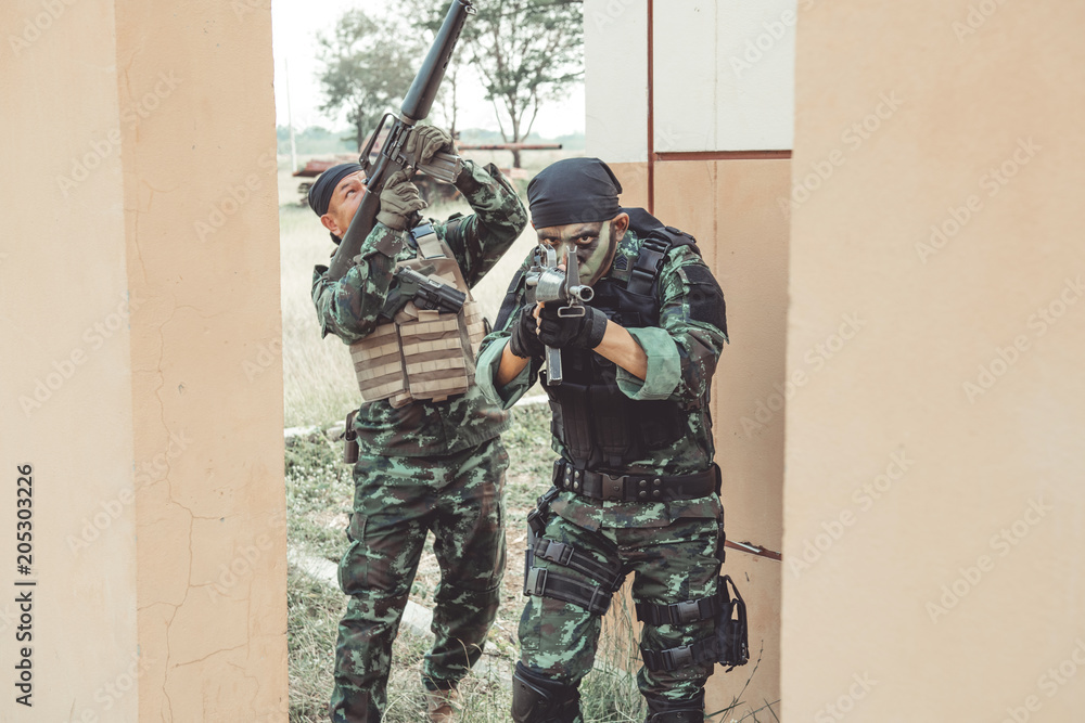 Special force soldiers in urban combat training. Breach and entry ...