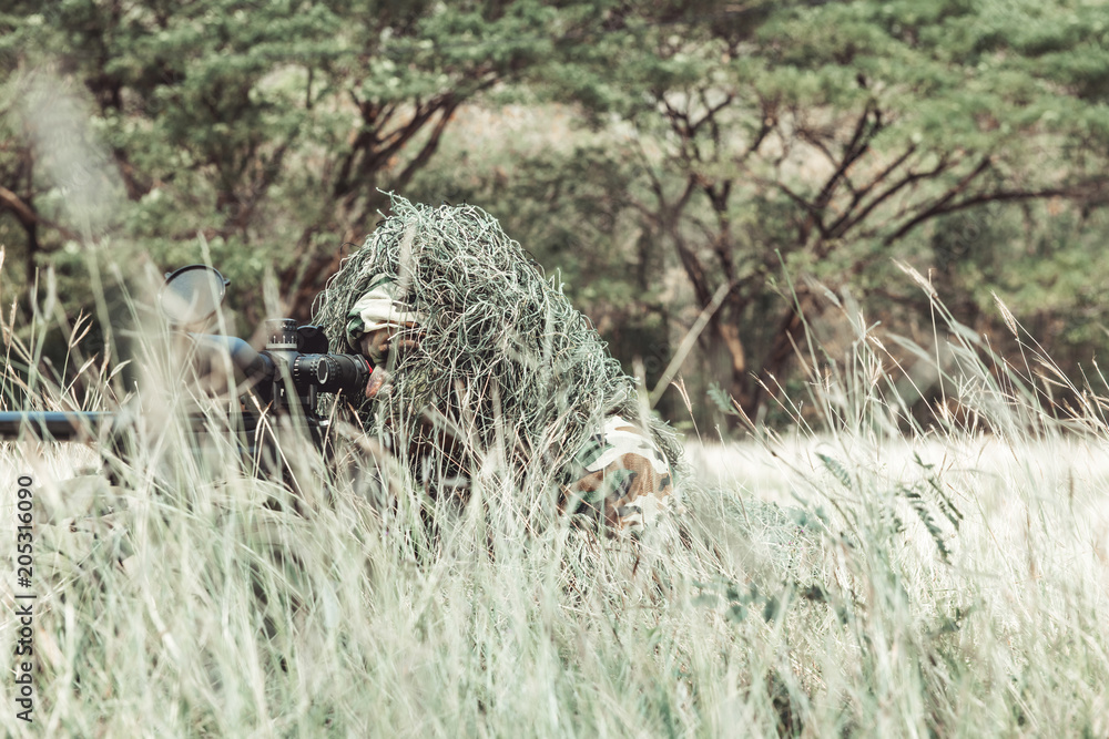 Sniper in urban combat training. Full ghillie camo suit and a high ...