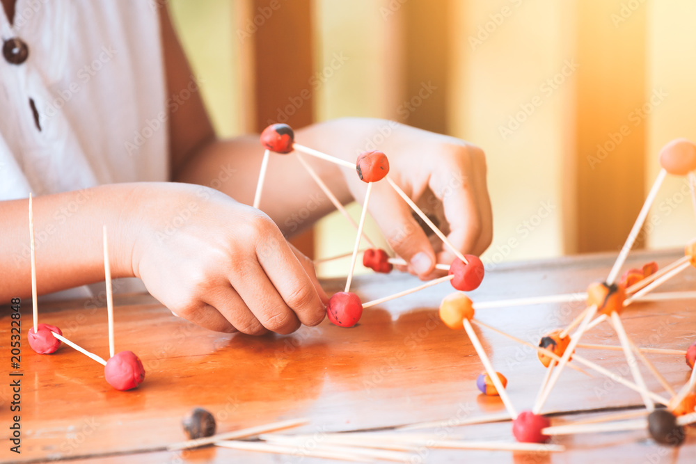 Cute asian child girl playing and creating with play dough and ...