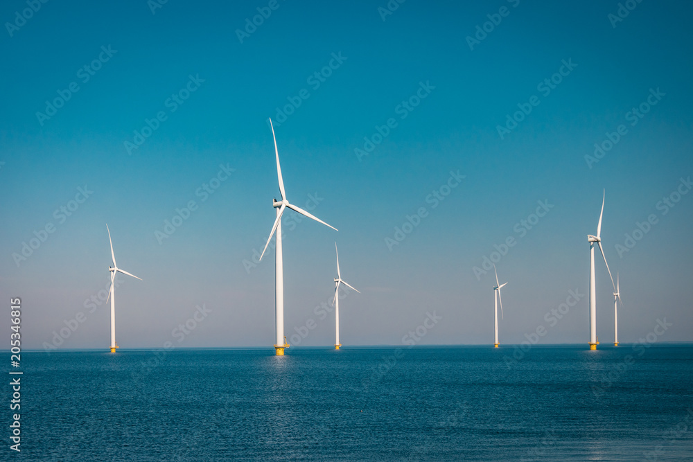 Offshore and Onshore Windmill farm in the ocean ,windmills isolated at ...