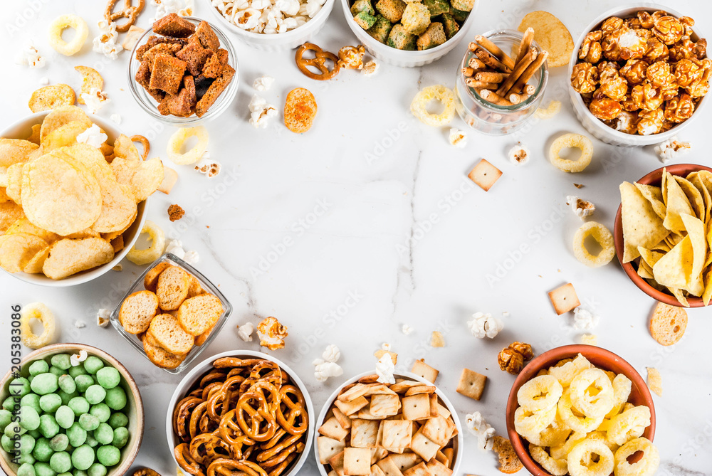 Variation different unhealthy snacks crackers, sweet salted popcorn ...