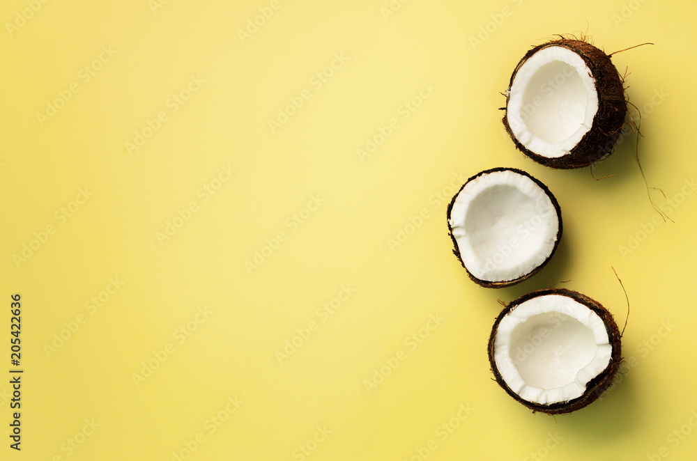 Pattern with ripe coconuts on yellow background. Top View. Copy Space ...