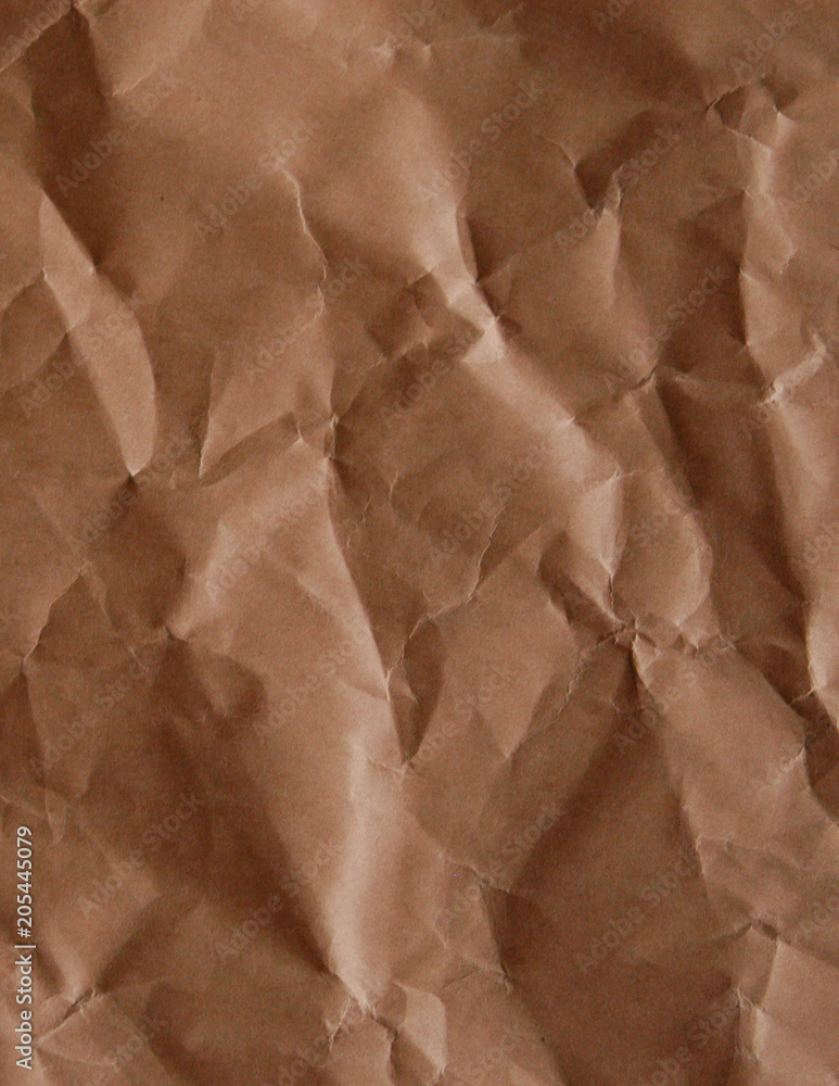 Texture of a brown paper bag wrinkled texture. Close up of a wrinkled ...