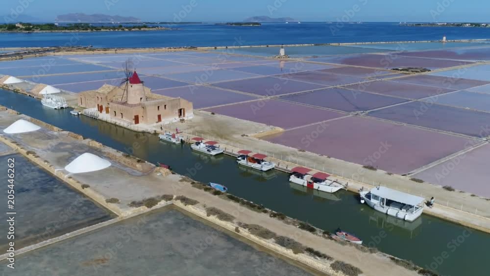 Video „Aerial of salt evaporation ponds salt mounds Italian windmill ...