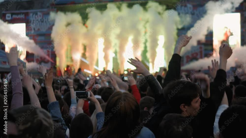 Crowd at music festival. Some of them recording with their smart phones ...