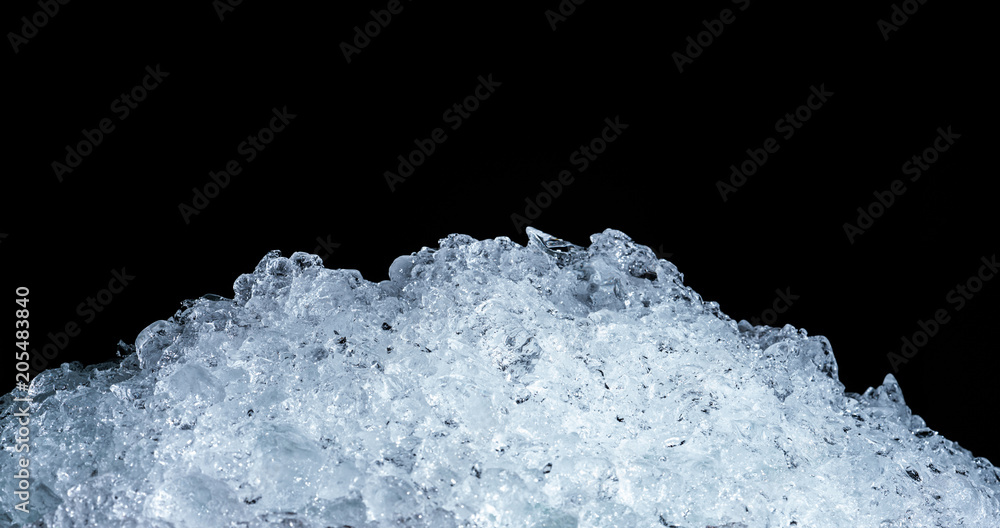 Pile of crushed ice cubes on dark background with copy space. Crushed ...