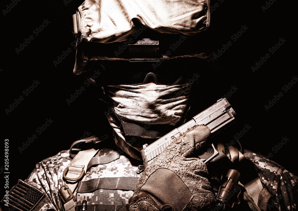 Special operations forces soldier in combat helmet with hidden behind ...