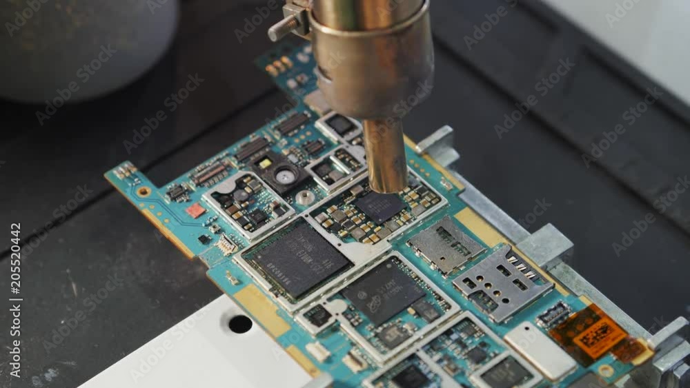 BGA chip soldering on the soldering station. Removal of temperature ...