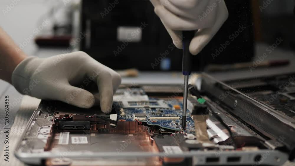 Closeup shot of male hands working on disassembling and cleaning ...