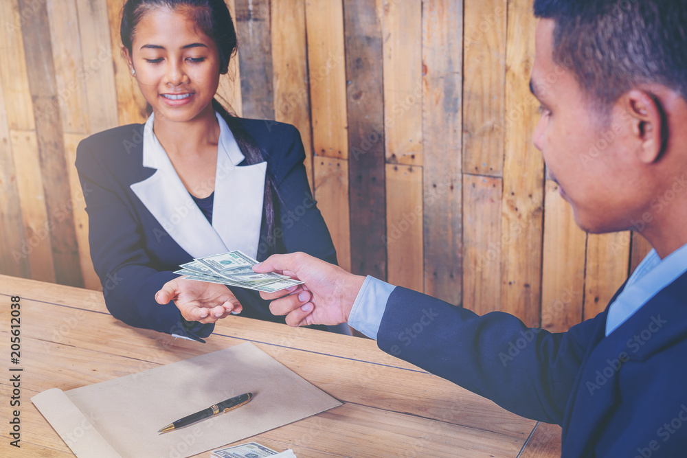 The boss paid the female employee wages. Salary concept Stock Photo ...