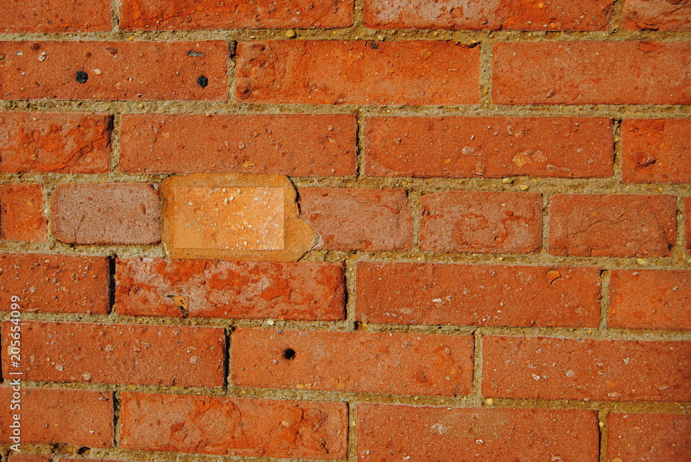 Stockfoto Textura de parede com tijolos cor de laranja e um tijolo no ...
