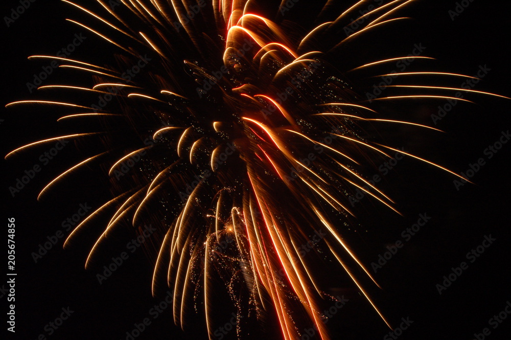 fireworks going off at night in the summer time Stock Photo | Adobe Stock