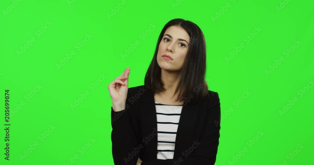 Portrait of the pretty Caucasian young woman in the black suit thinking ...