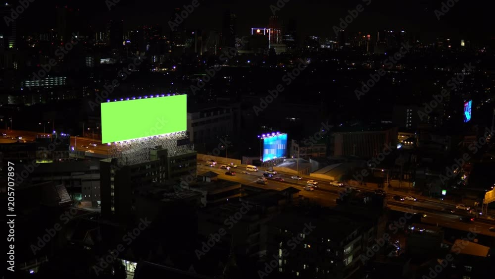 4K Time lapse: Billboard green screen with city night traffic lights ...