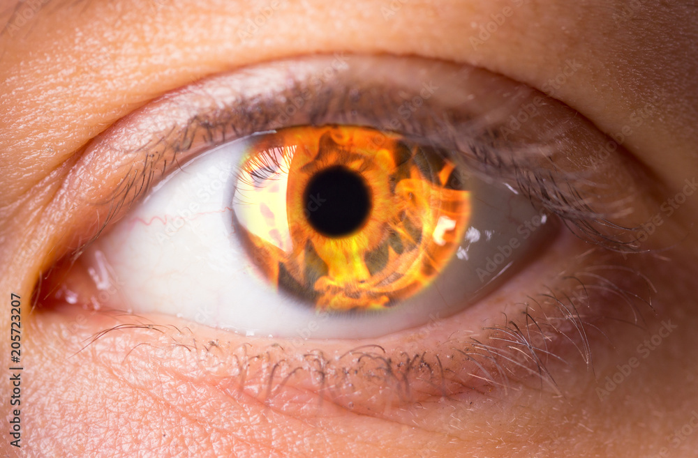 woman eye with burning fire in it Stock Photo | Adobe Stock