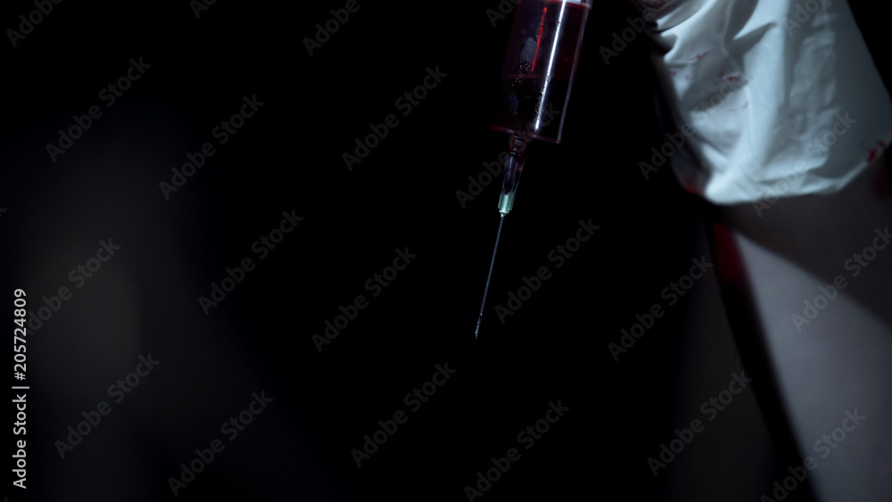 Scary blood syringe in doctors hand, deadly infection danger, terrible ...