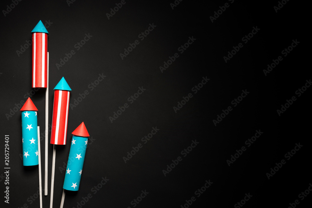July 4, rockets for fireworks on a blue red background with space for ...