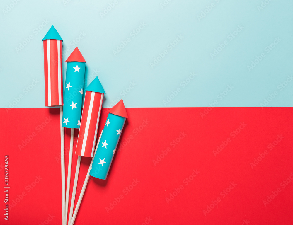 July 4, rockets for fireworks on a blue red background with space for ...