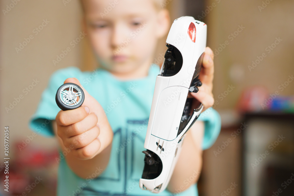 boy broke the toy. broken wheel from the car Stock Photo | Adobe Stock
