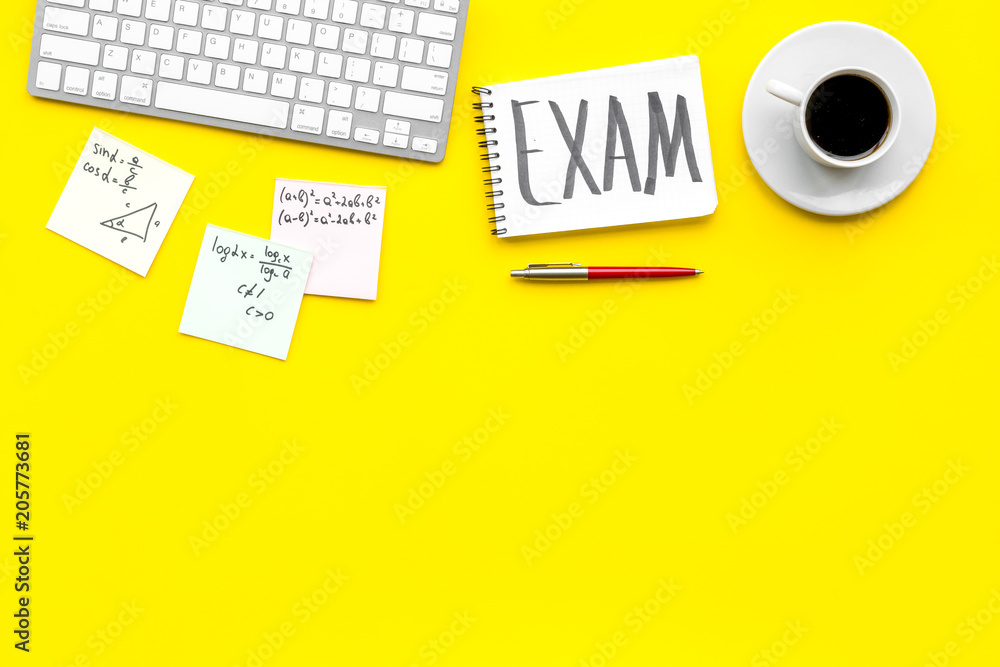 Preparing for the exam. Word Exam written in notebook on student's desk ...