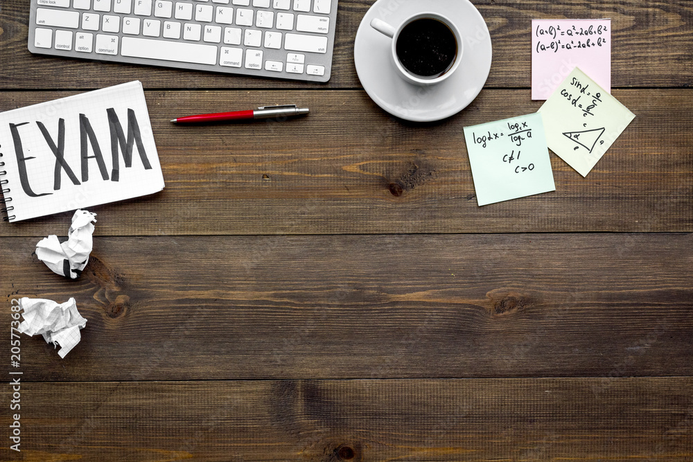 Preparing for the exam. Word Exam written in notebook on student's desk ...