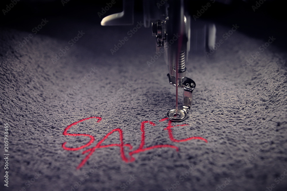 embroidery of red lettering SALE on soft grey fabric with embroidery ...