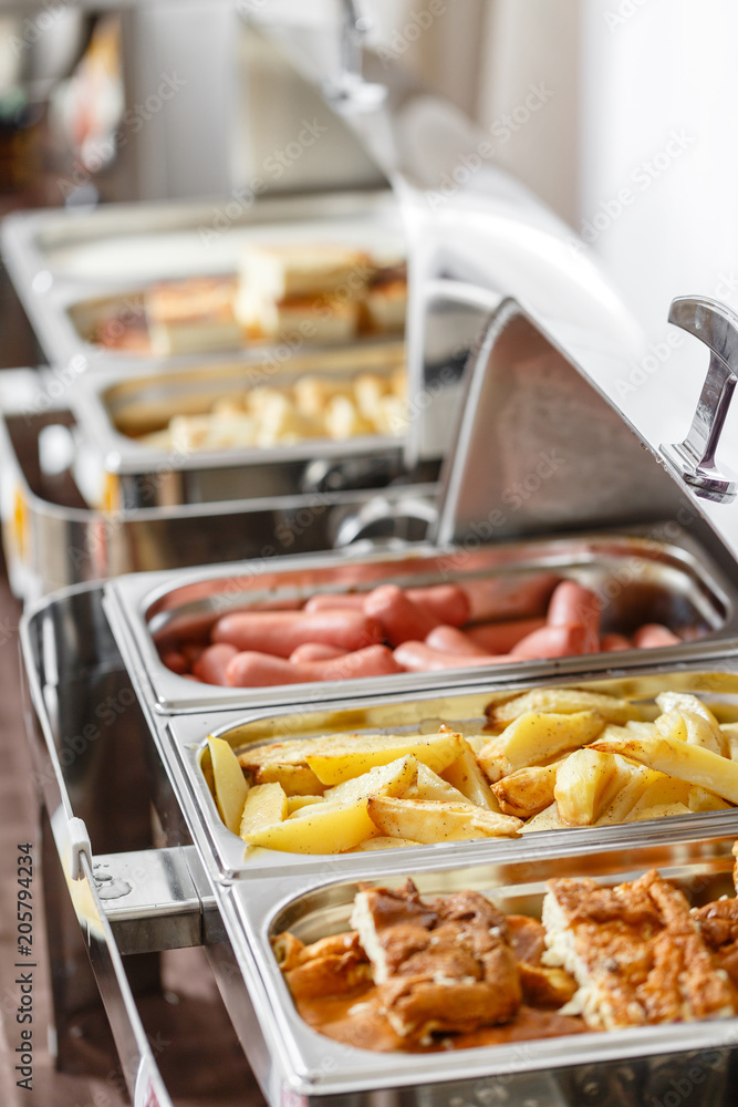 Buffet trays heated ready for service. Breakfast in hotel smorgasbord ...