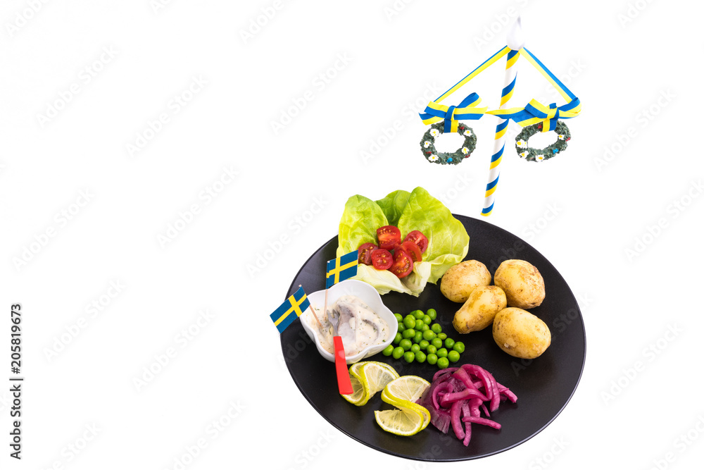 Swedish traditional midsummer food with herring and potatoes and a ...