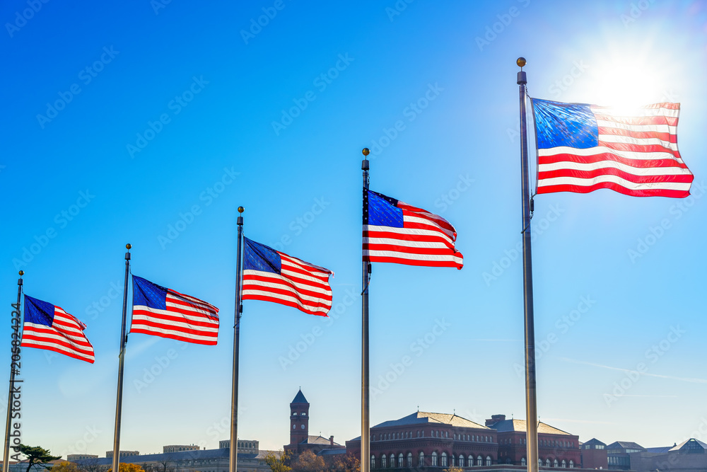 Flags of the United States waving over blue sky in Washington DC Stock ...