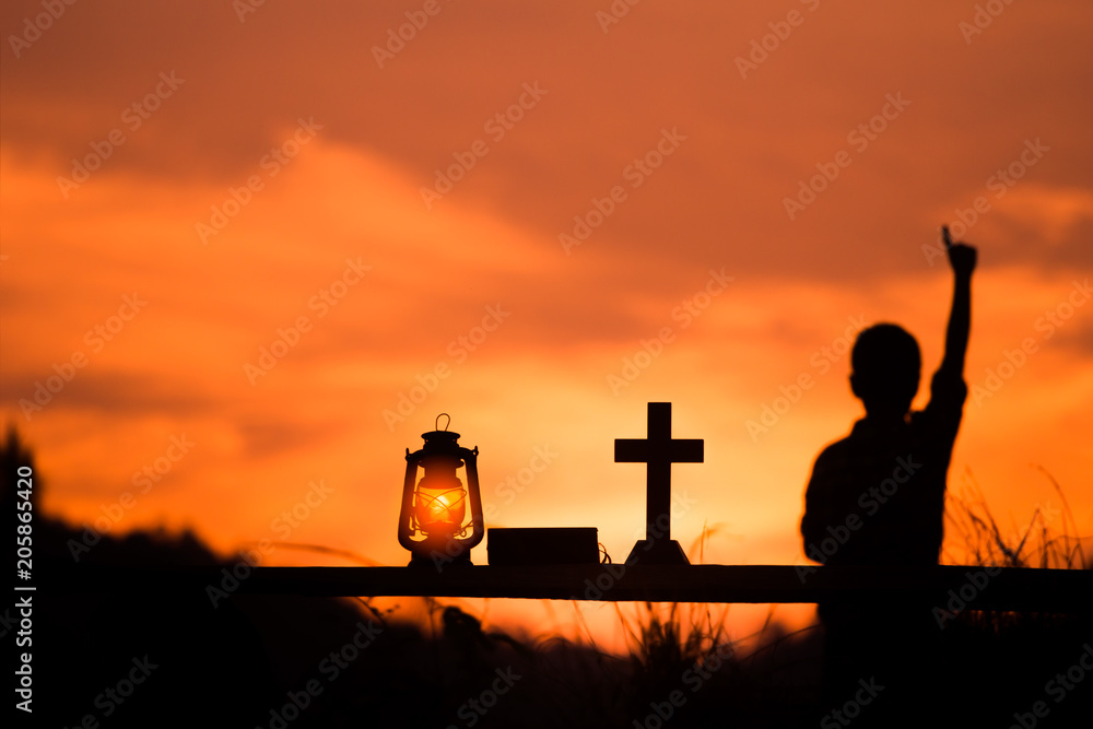 Boy lift hand to worship God, christian concept Stock Photo | Adobe Stock
