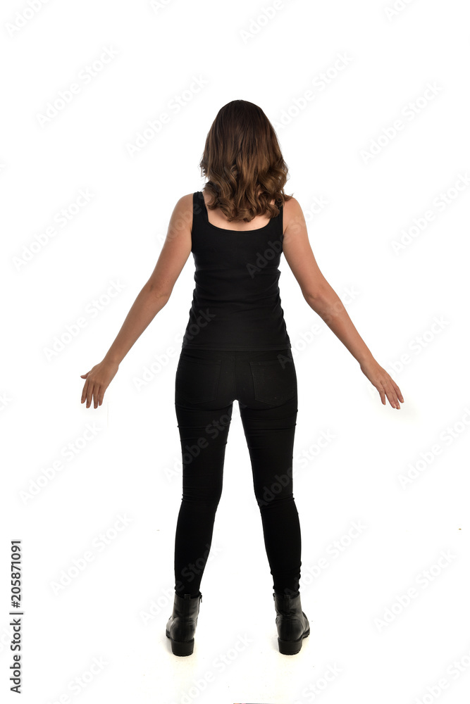 full length portrait of brunette girl wearing black singlet, jeans ...