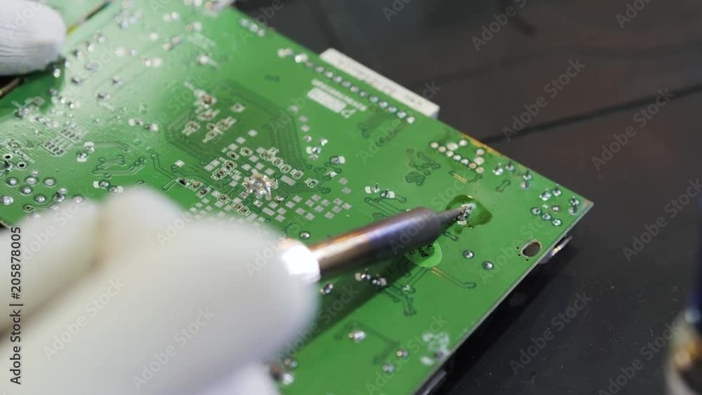 BGA chip soldering on the soldering station. Removal of temperature ...