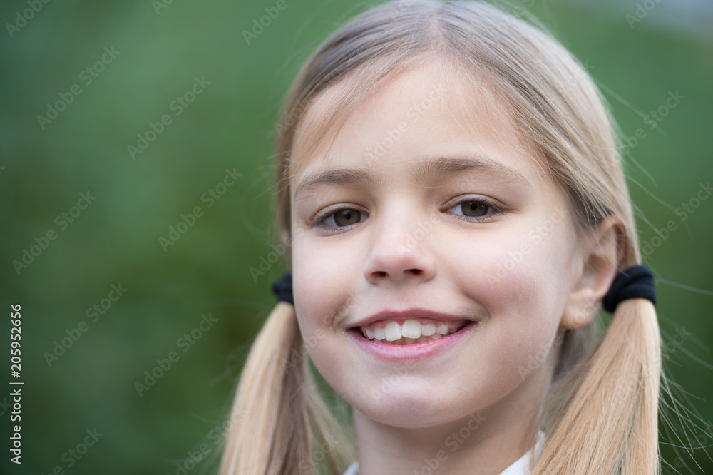 Beauty kid with fresh look and skin. Little girl smile with long blond ...