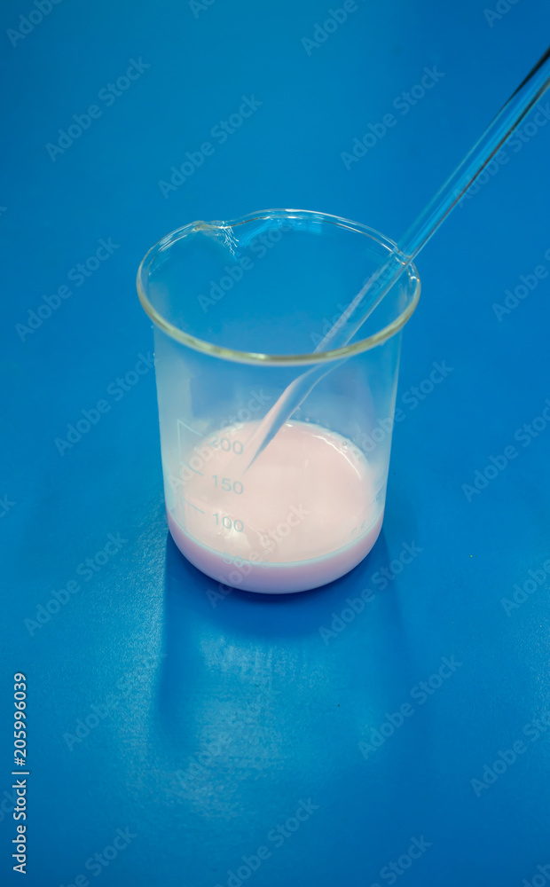 Soap making process in laboratory. Coloring and stirring with stirrer ...