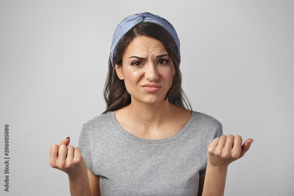 Irritated angry beautiful young housewife can't hide her negative ...