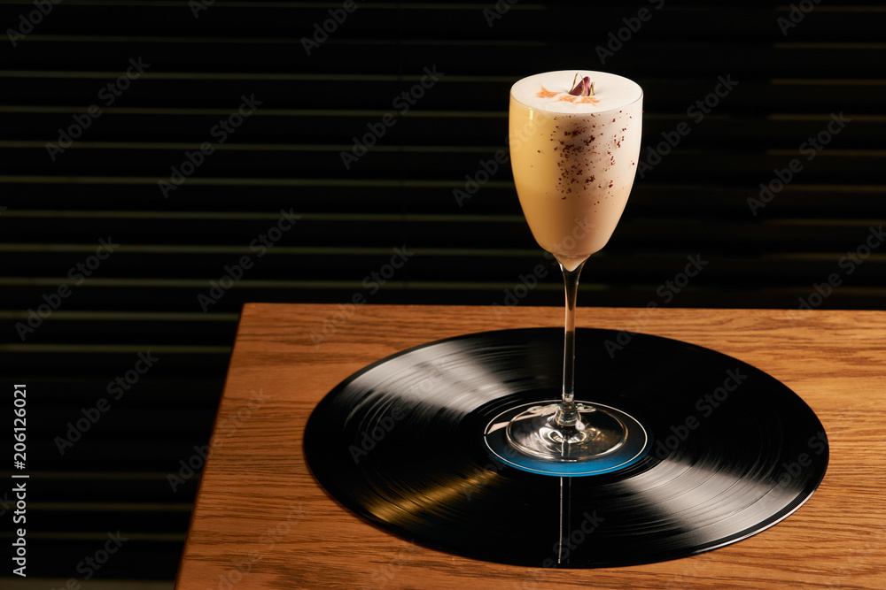 Classical Lucy cocktail on vinyl tray background. Cocktail with Gin ...