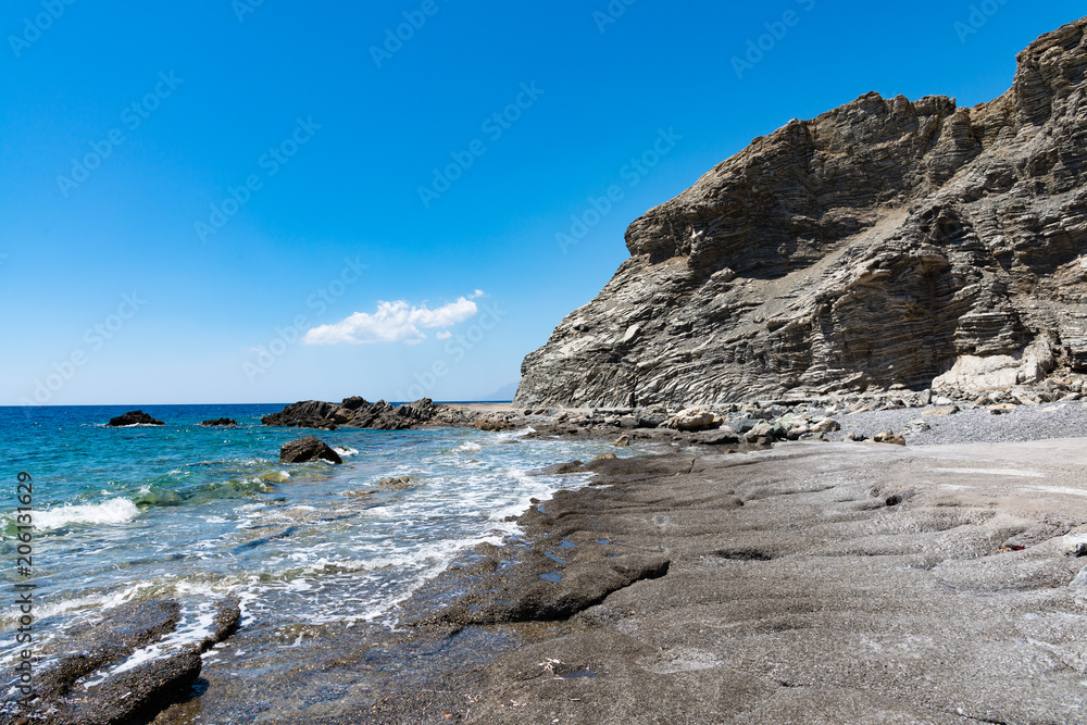 Compressed rock layers formation in various colors and thicknesses, on ...