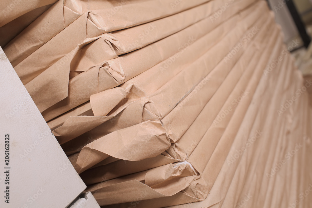 Stack of graphic paper in the wrapping, industrial background, with ...