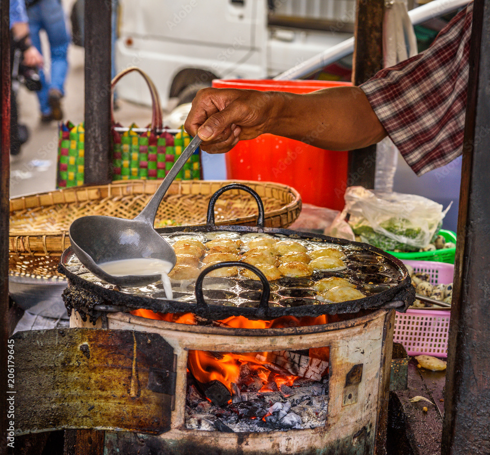 Cook prepares street food in Myanmar Stock Photo | Adobe Stock