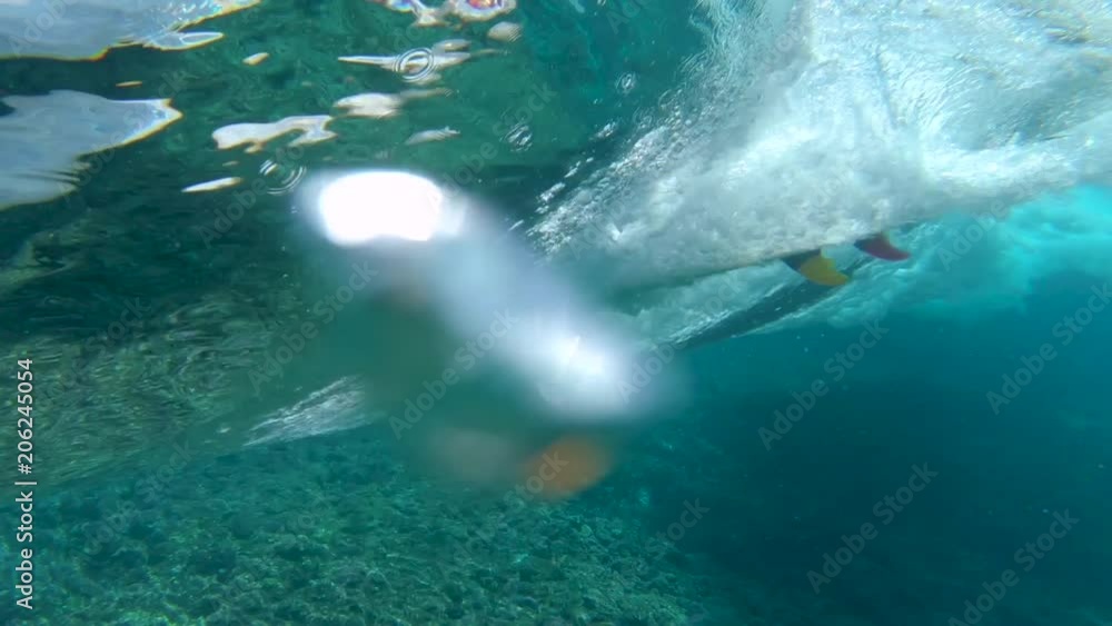 SLOW MOTION, UNDERWATER: Cool surfer girl riding big barrel waves near ...