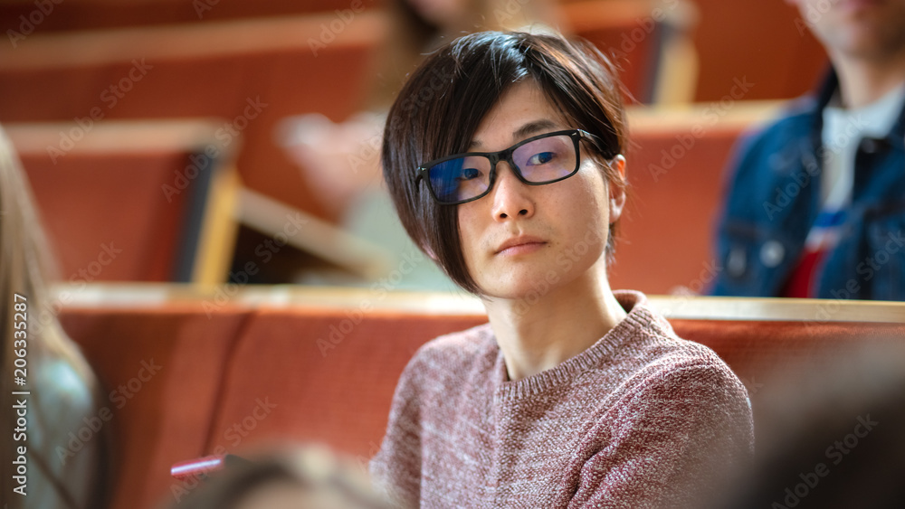 In the Classroom Smart Asian Student Listening to a Lecture in the ...