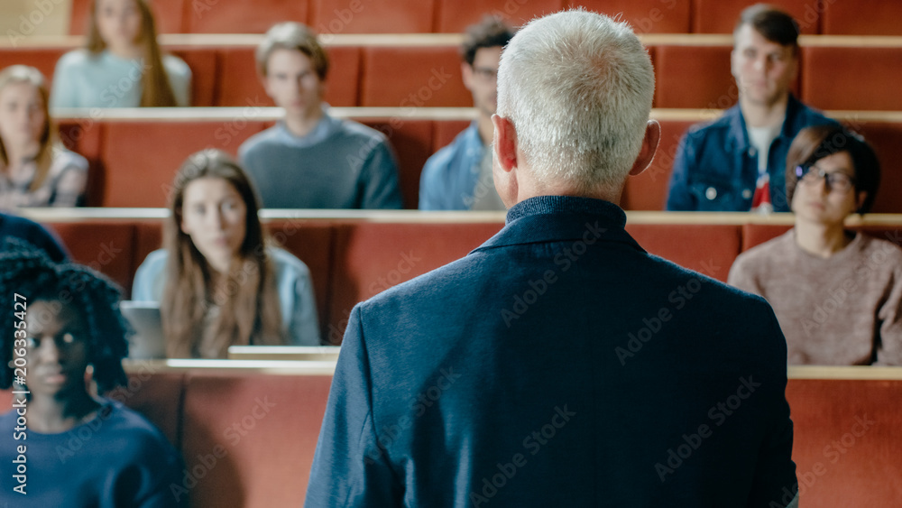 Camera Facing Class: College Professor Gives a Lecture to a Classroom ...