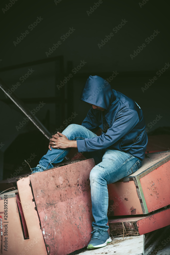 Portrait of asian man sad,drug addict man sitting on the floor,flakka ...