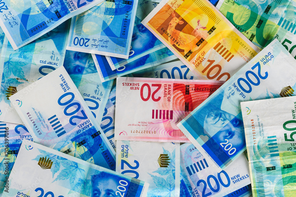 Pile of NIS - New Israeli Shekels banknotes with the new 200, 100, 20 ...