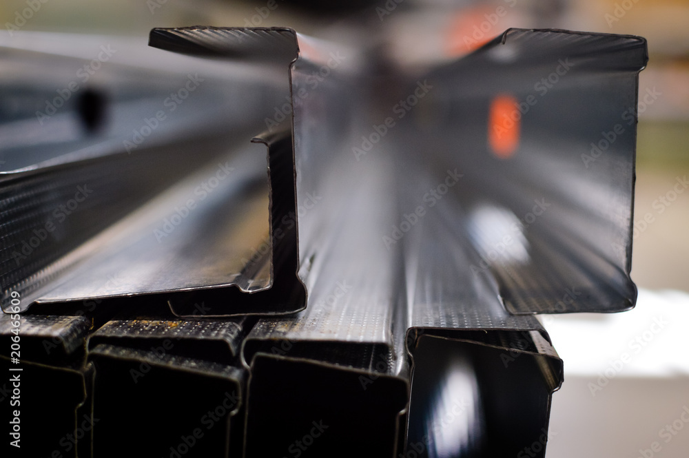 Close up of aluminium profile stacked steel background. industrial ...