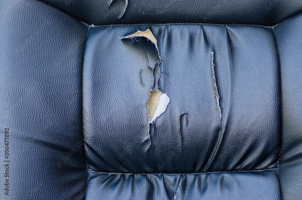 Torn car seat black leather ruptured foam rubber Stock Photo | Adobe Stock