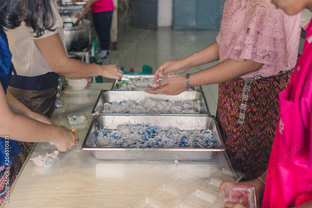 Teachers and students are helping to packing Thai Coconut munchk Stock Photo | Adobe Stock